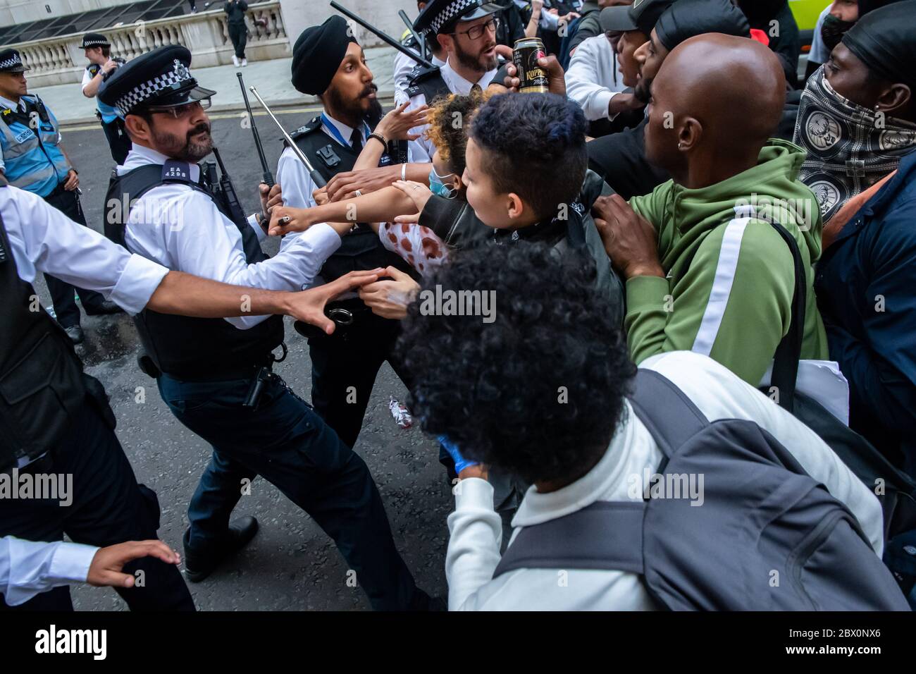London, United Kingdom. 3rd June, 2020. Protesters and police face off ...