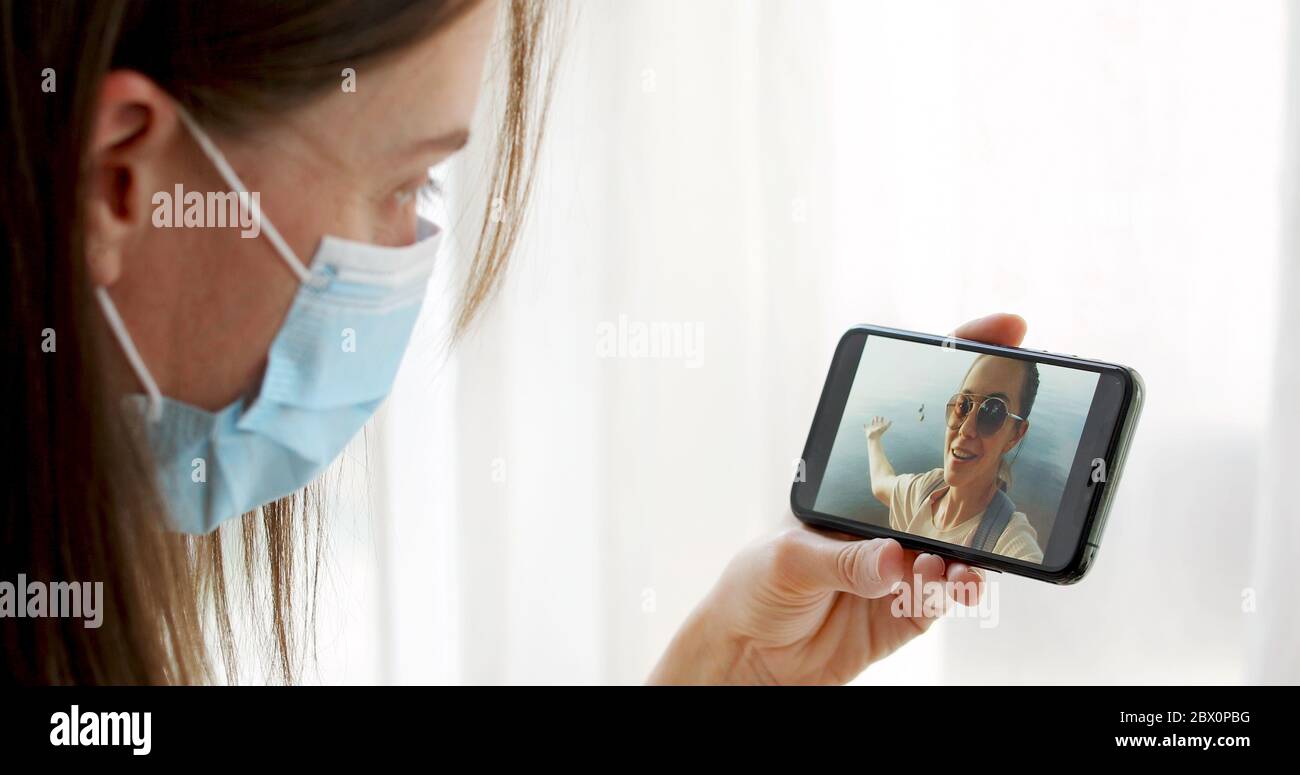 Masked woman on the phone hi-res stock photography and images - Alamy