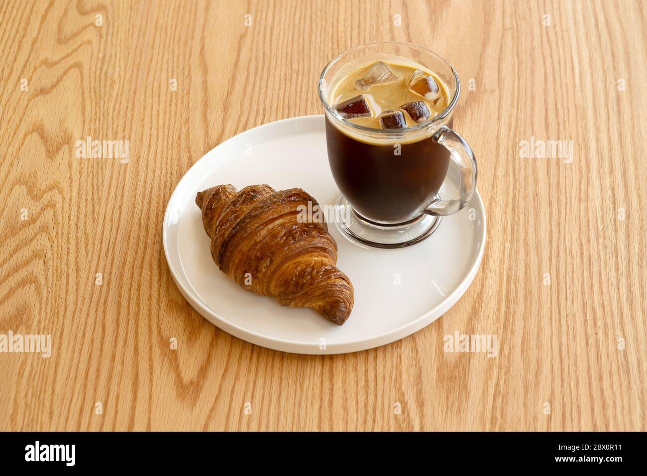 Ice coffee and croissant. breakfast Stock Photo - Alamy