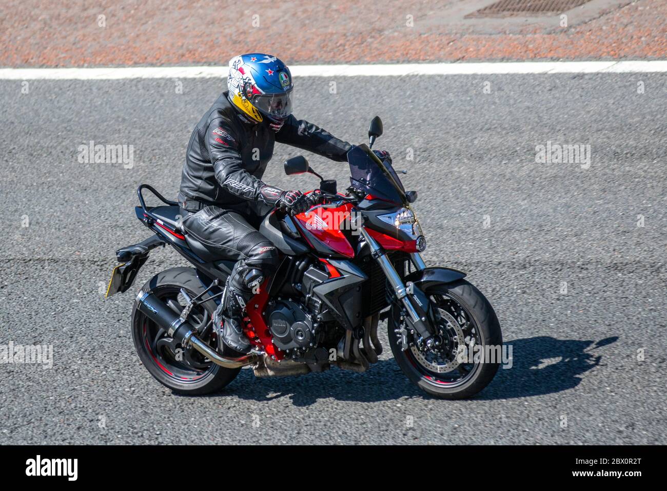 Red Honda Motorbike rider; two wheeled transport, motorcycles, vehicle ...