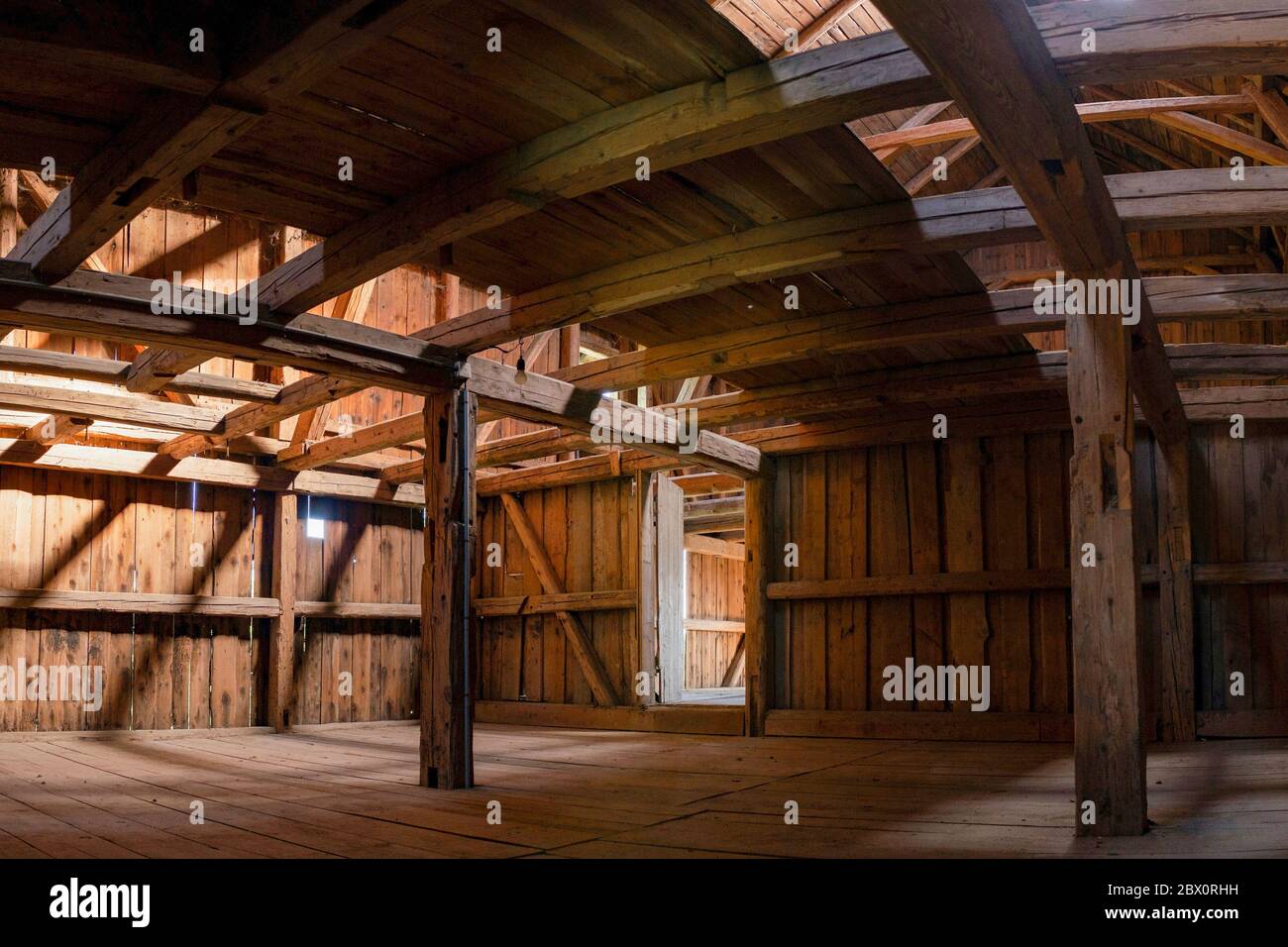 Interior of large old wooden German Barn during renovation, looking up ...