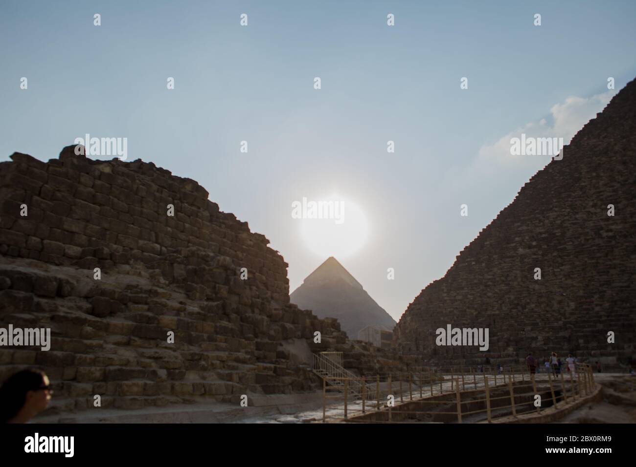 sunset on the background of Egyptian pyramids Stock Photo - Alamy
