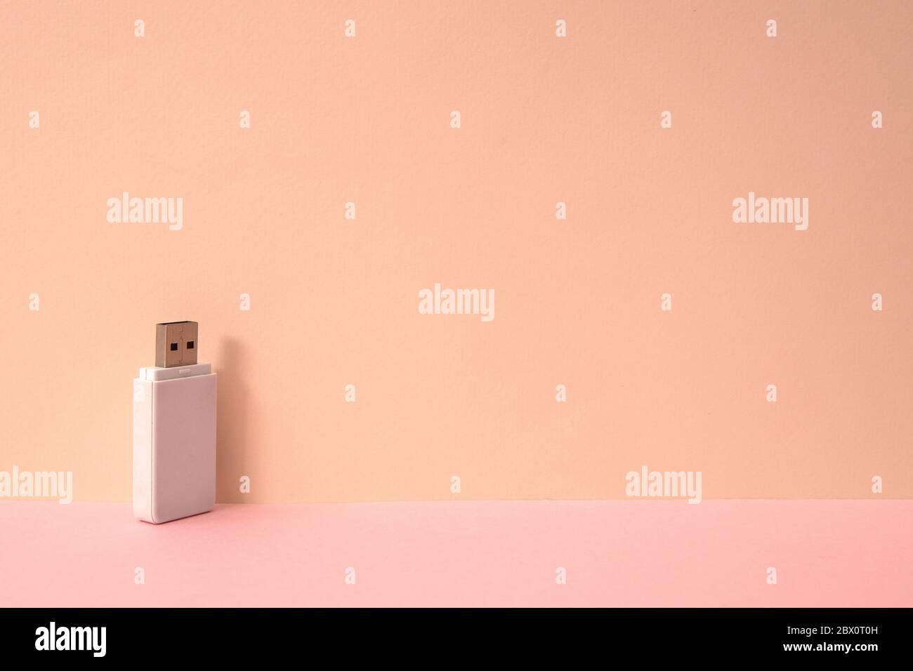 Pink color background and white USB memory storage Stock Photo - Alamy