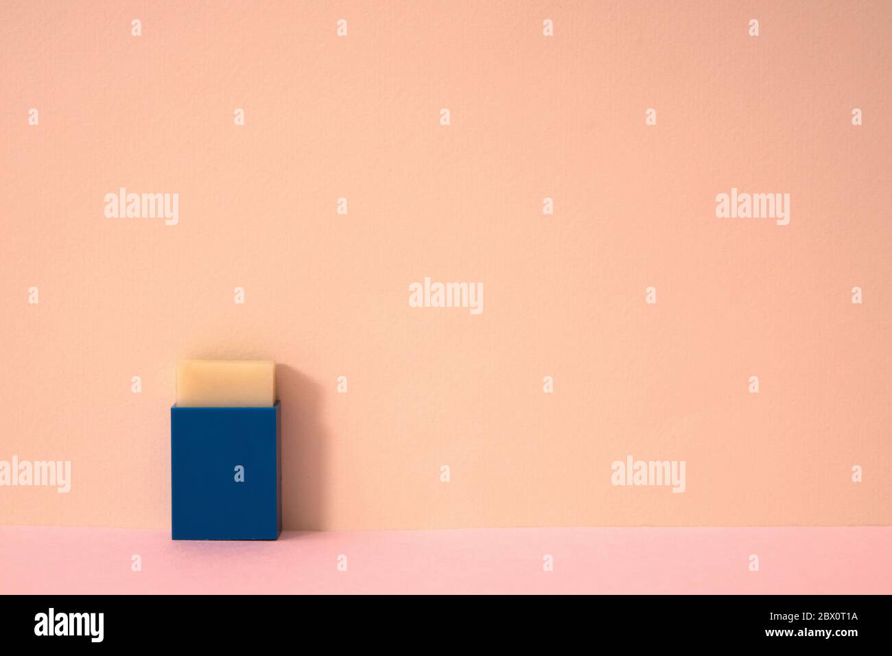 Pink color background and square eraser Stock Photo - Alamy