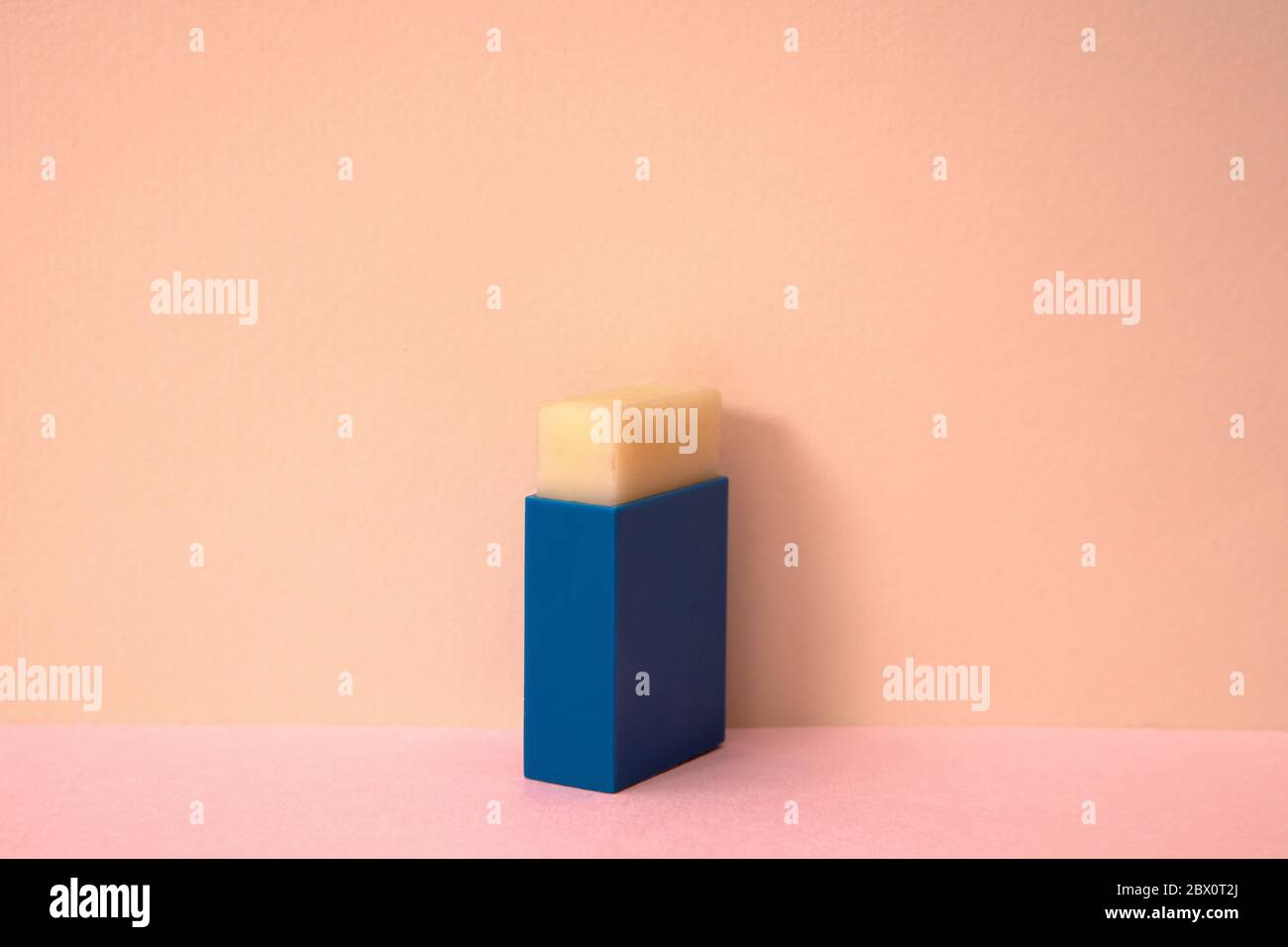 Pink color background and square eraser Stock Photo - Alamy