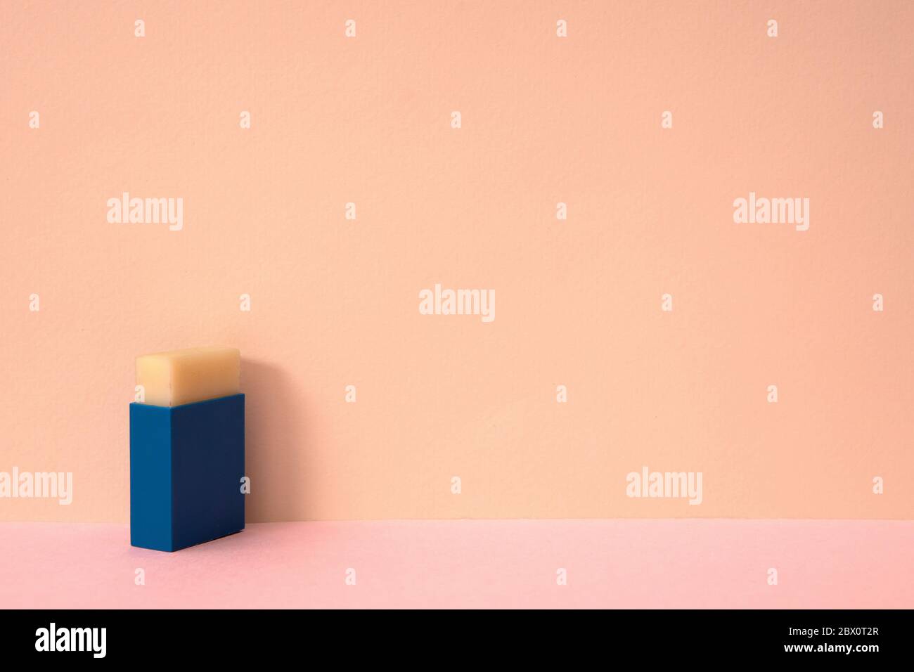 Pink color background and square eraser Stock Photo - Alamy