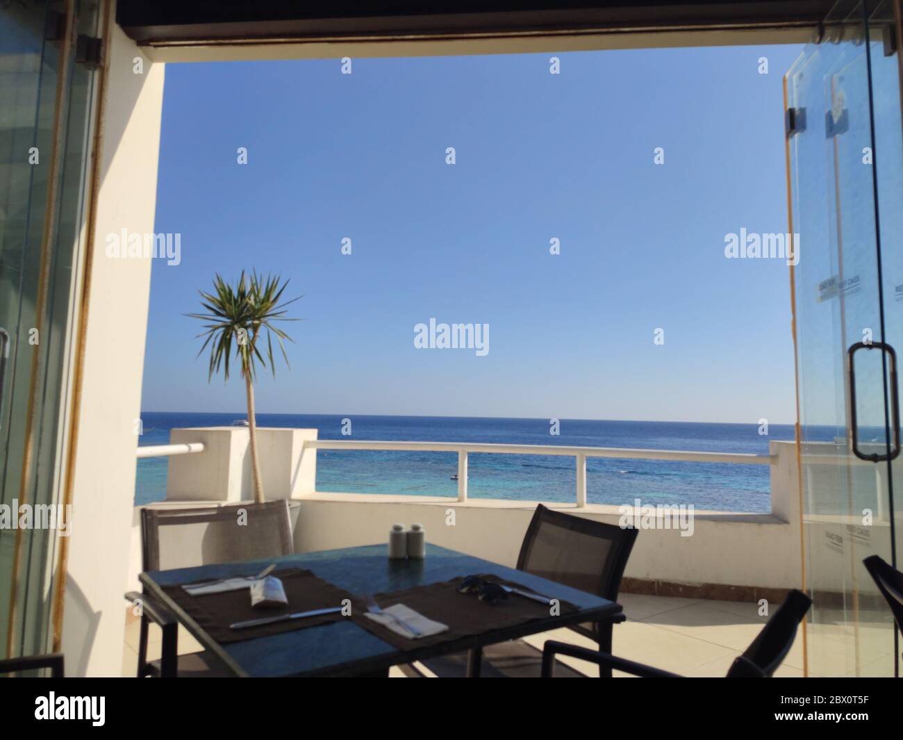 tables in a restaurant on background of the sea Stock Photo - Alamy