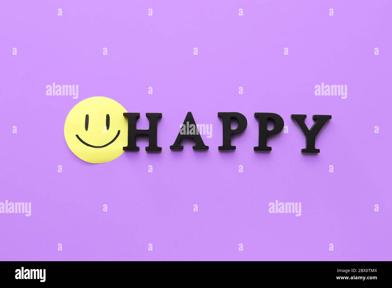 Word HAPPY and paper smile on color background Stock Photo - Alamy