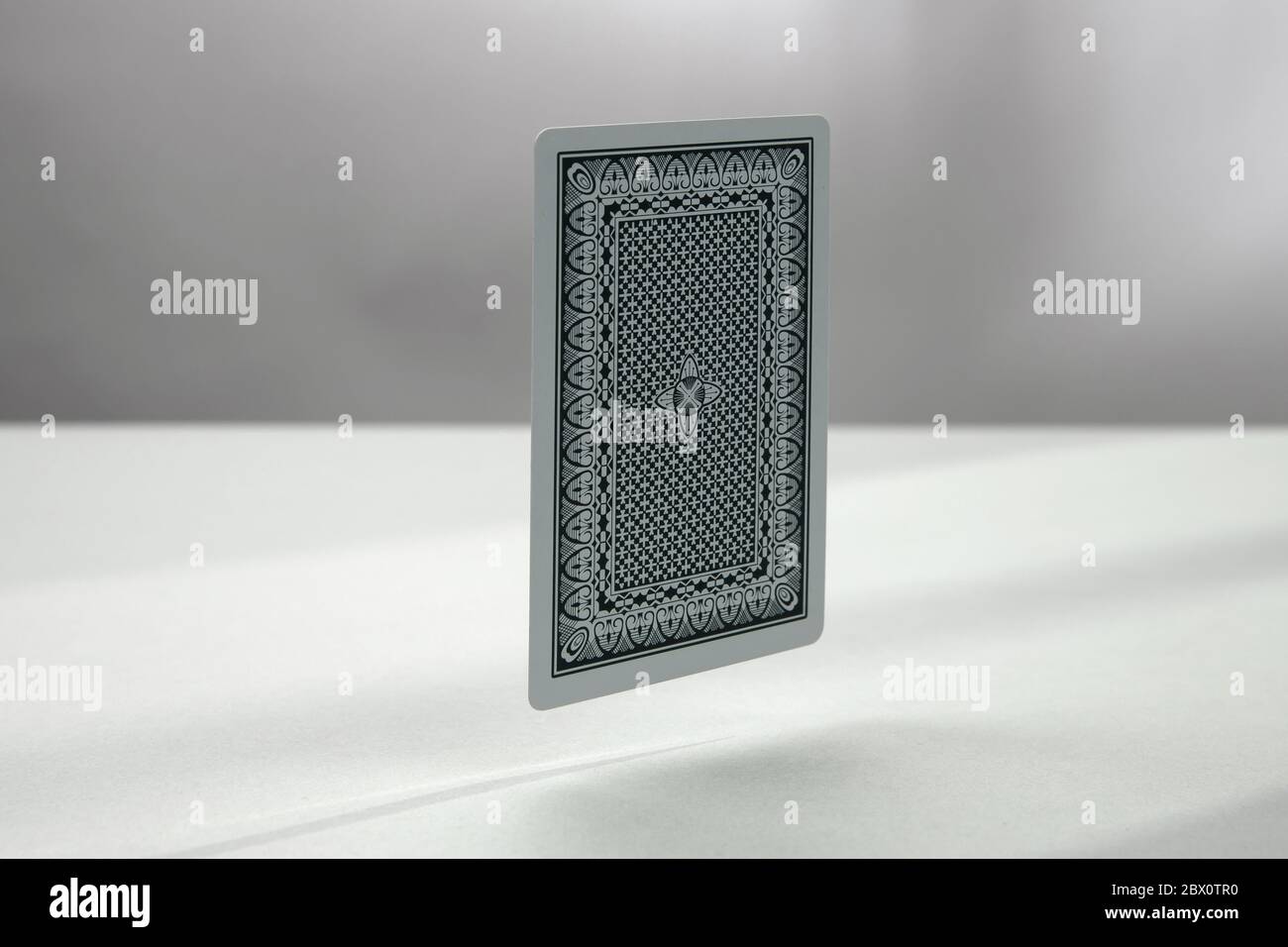 Back side of playing card. a dark background Stock Photo - Alamy