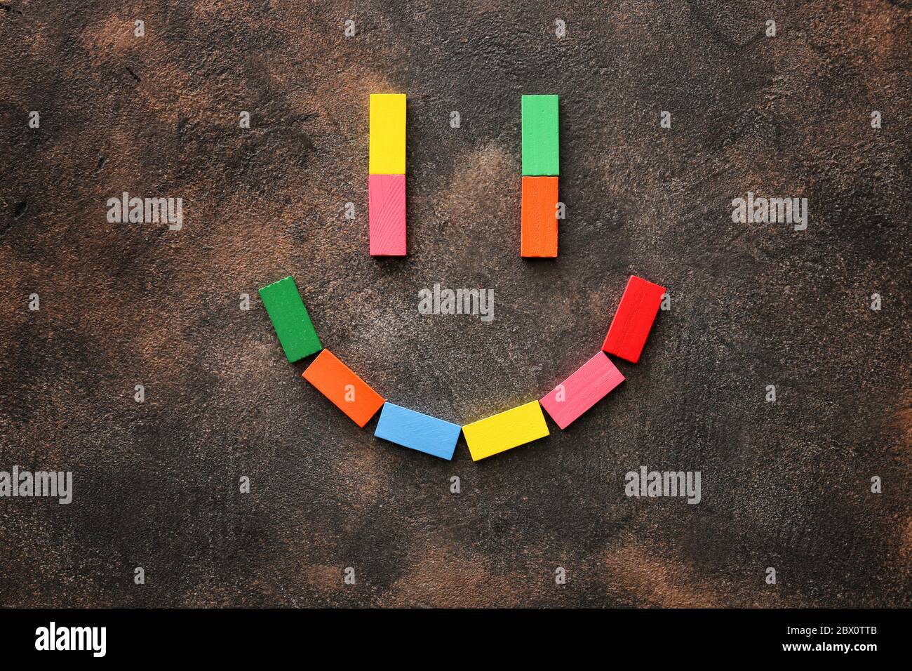 Smile made of blocks on dark background Stock Photo - Alamy