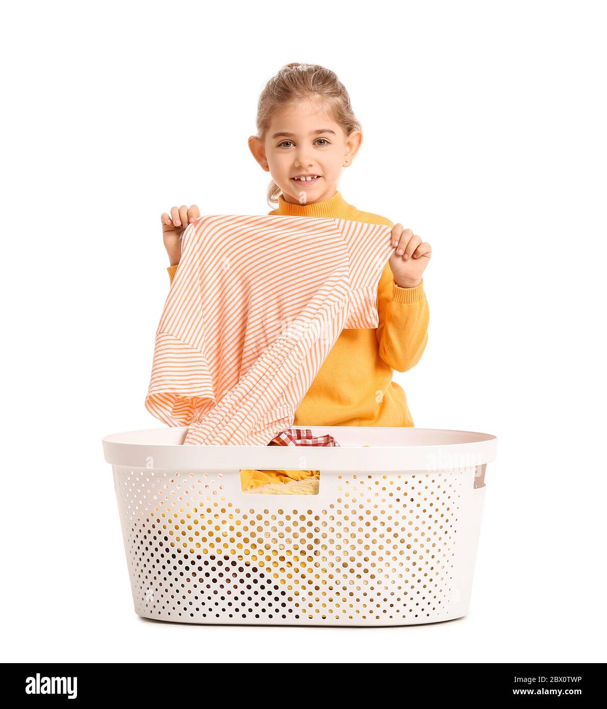Little girl with laundry on white background Stock Photo - Alamy