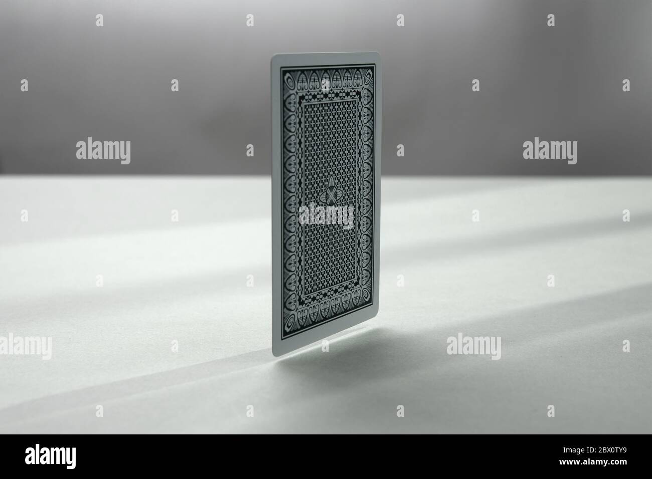 Back side of playing card. a dark background Stock Photo - Alamy