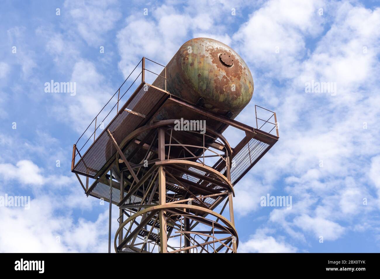 Upward view of rusty metal tower, tank for water Stock Photo - Alamy