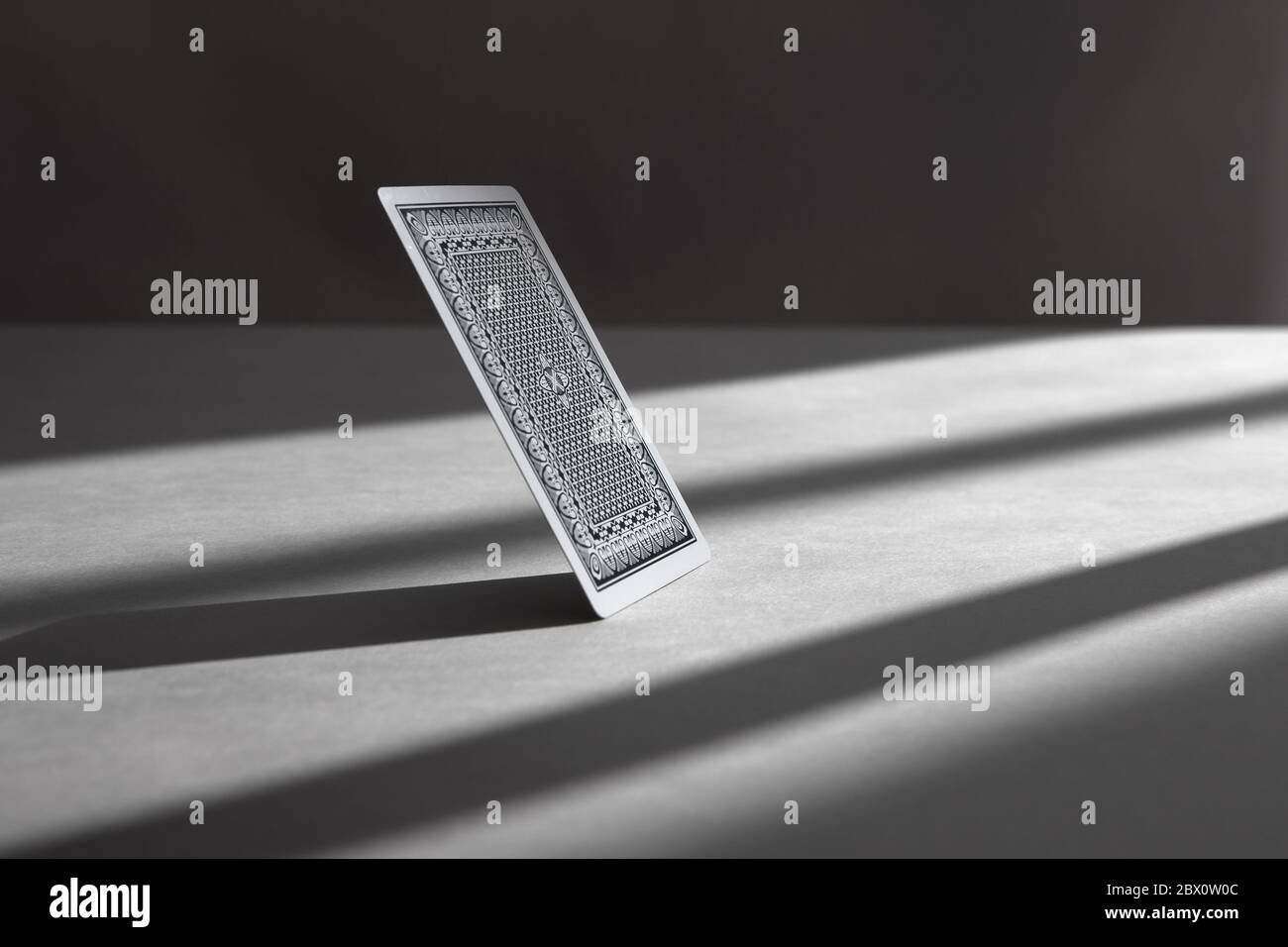 Back side of playing card. a dark background Stock Photo - Alamy