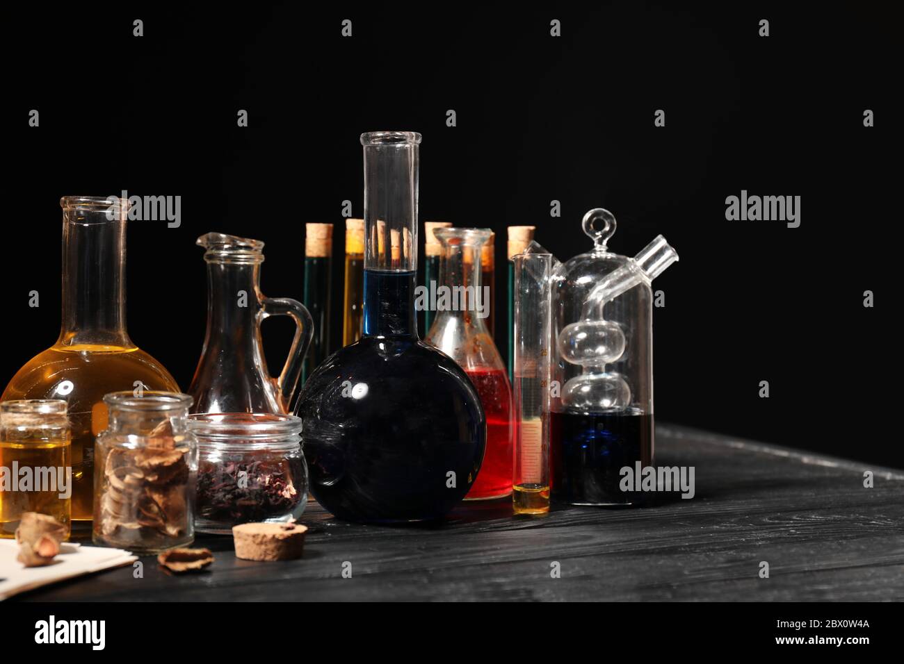 Different potions on alchemist's table Stock Photo - Alamy