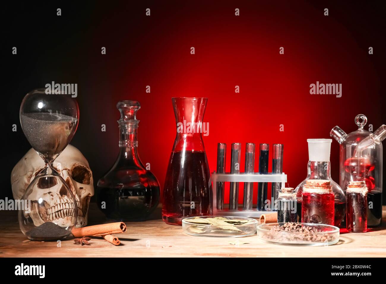 Different potions on alchemist's table Stock Photo - Alamy
