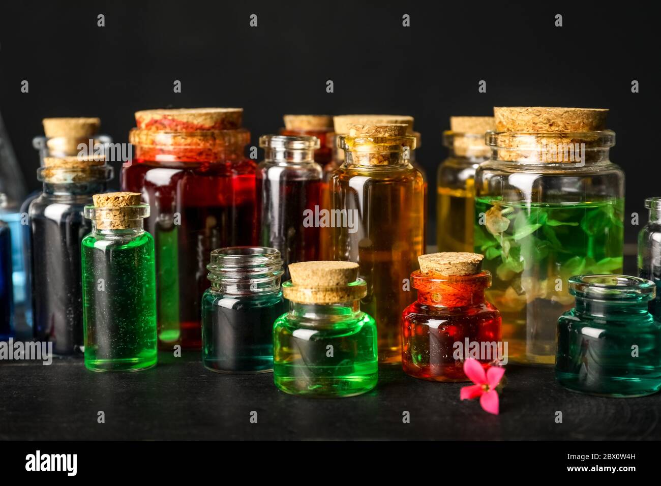 Different potions on alchemist's table Stock Photo - Alamy