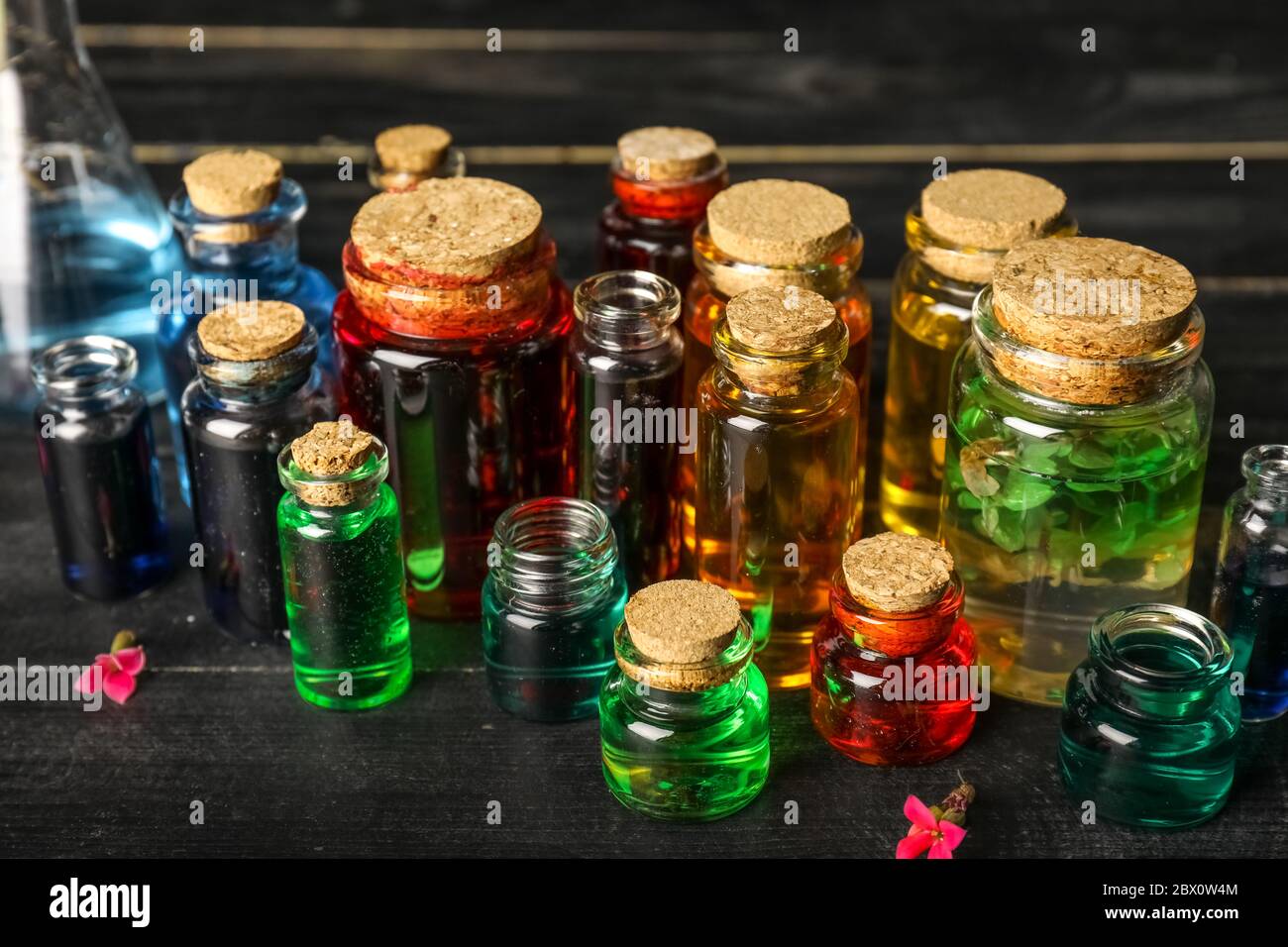 Different potions on alchemist's table Stock Photo - Alamy