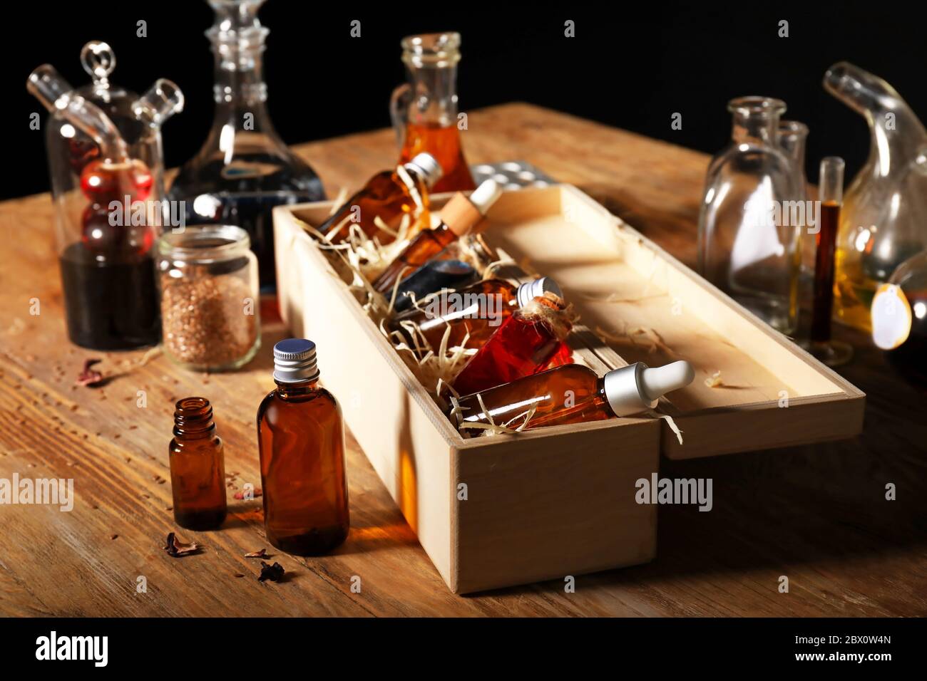 Different potions on alchemist's table Stock Photo - Alamy
