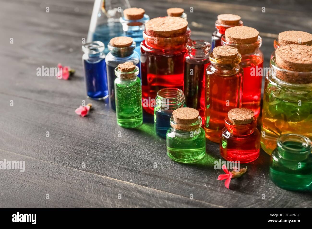 Different potions on alchemist's table Stock Photo - Alamy