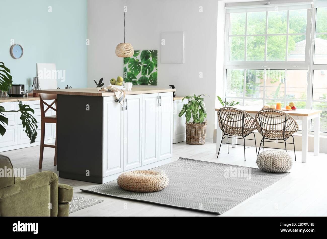 Interior of modern kitchen with stylish table Stock Photo - Alamy