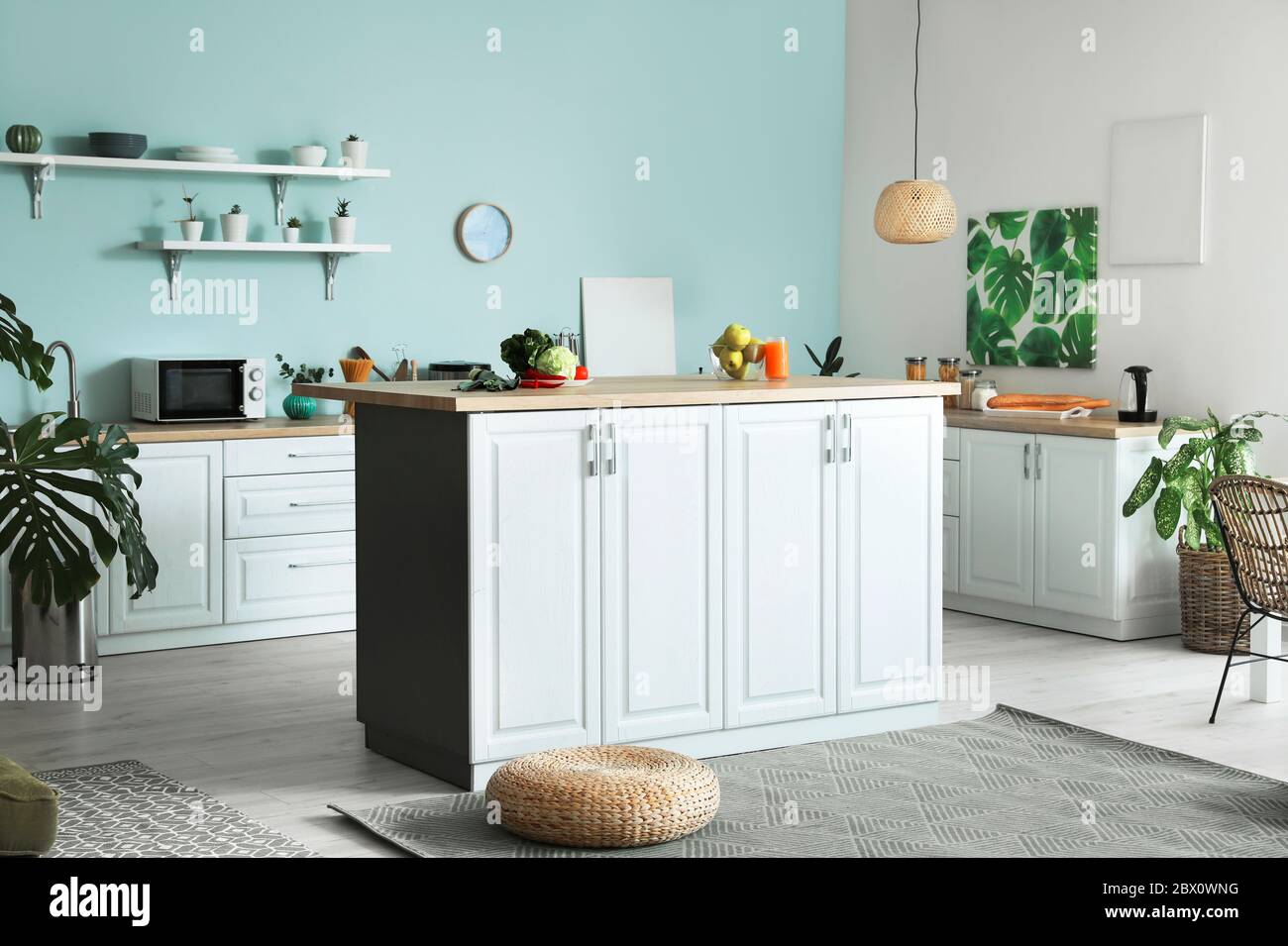 Interior of modern kitchen with stylish table Stock Photo - Alamy