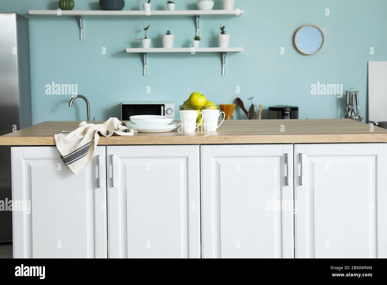 Stylish table in modern kitchen Stock Photo - Alamy