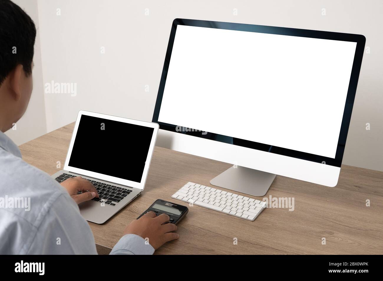 young man working Businessman using a desktop computer of the blank ...