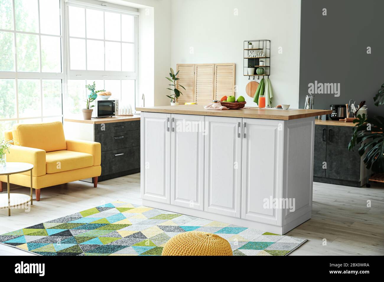 Interior of modern kitchen with stylish table Stock Photo - Alamy