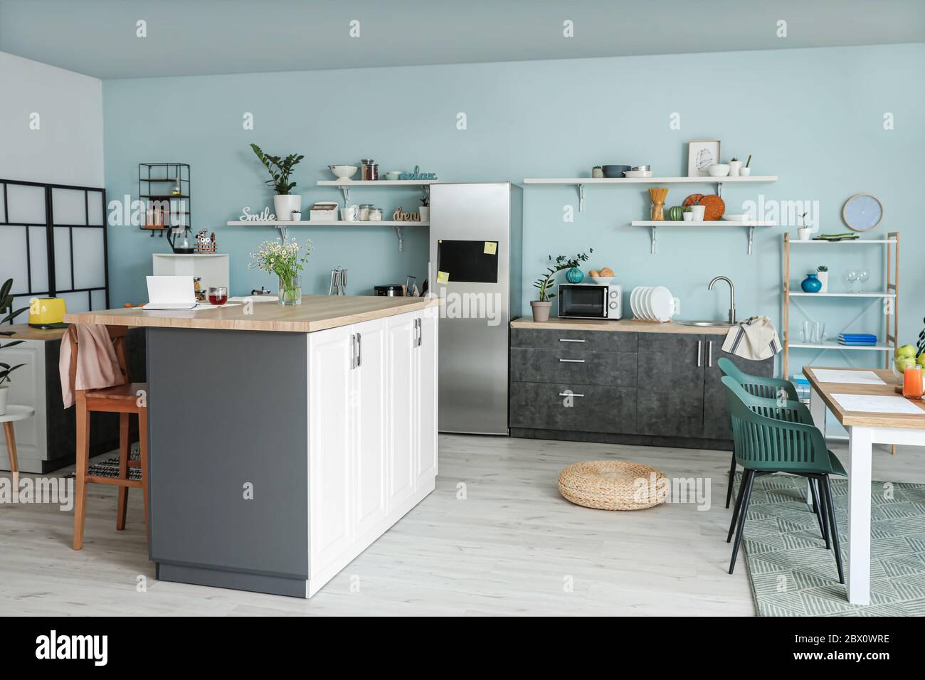 Interior of modern kitchen with stylish table Stock Photo - Alamy