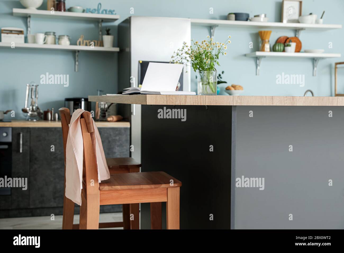 Stylish table in modern kitchen Stock Photo - Alamy