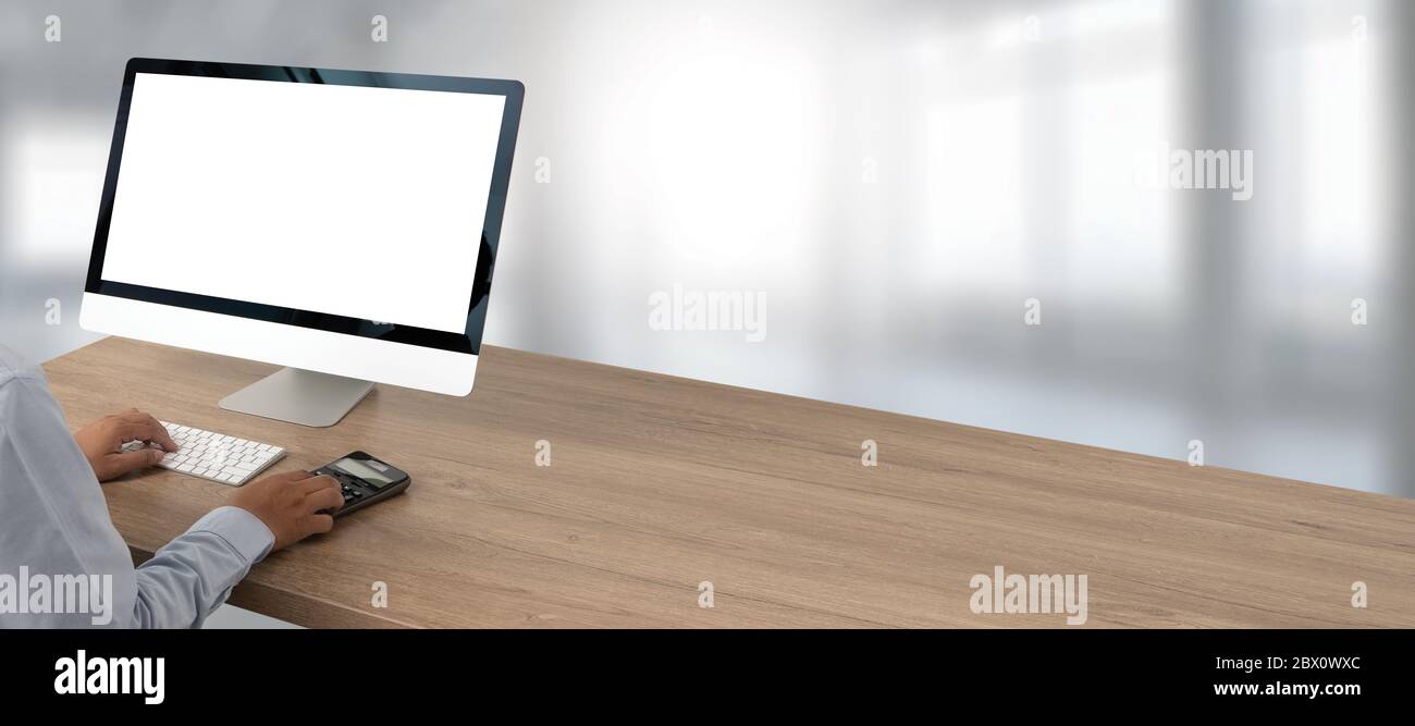 young man working Businessman using a desktop computer of the blank ...
