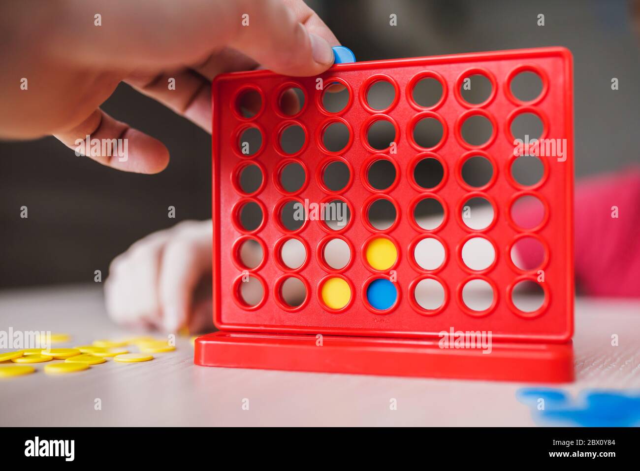 Board game close up - four in a line Stock Photo - Alamy