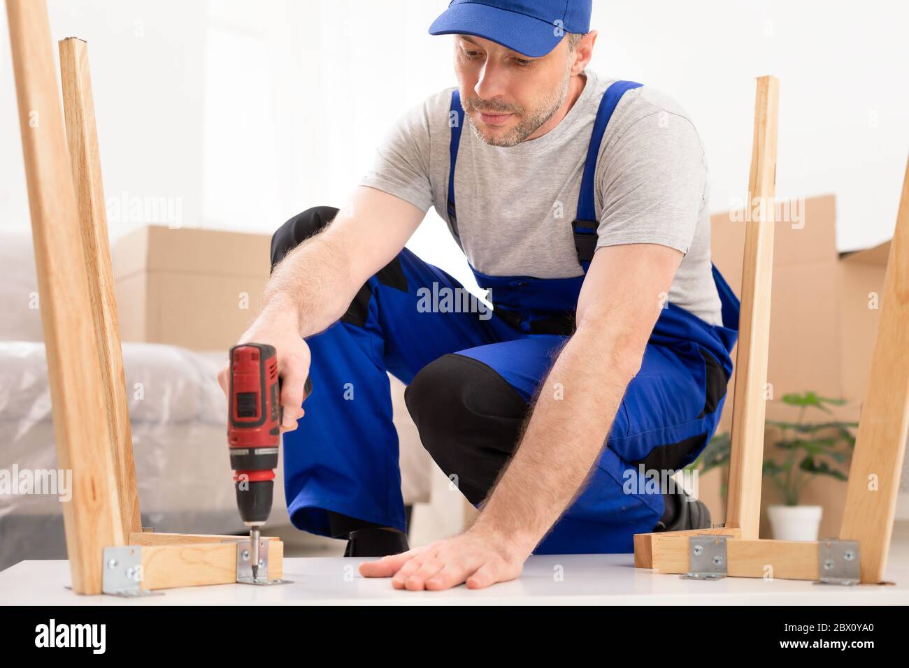 Workman Fixing Table Furnishing Home After Renovation Indoor Stock ...