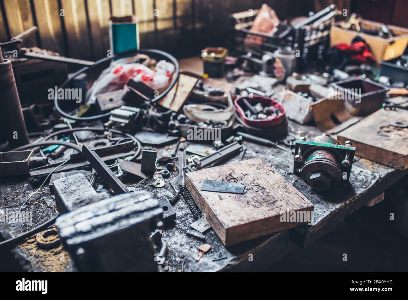 Bench table workbench with lots of metal parts Stock Photo - Alamy