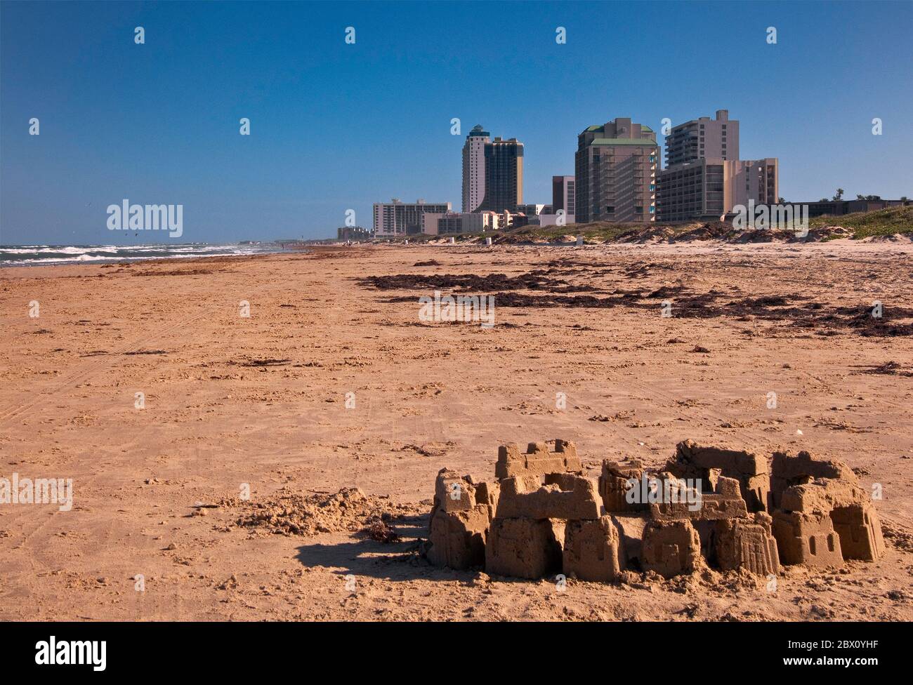 Condominium and hotel towers, sand castle on beach at Gulf of Mexico ...