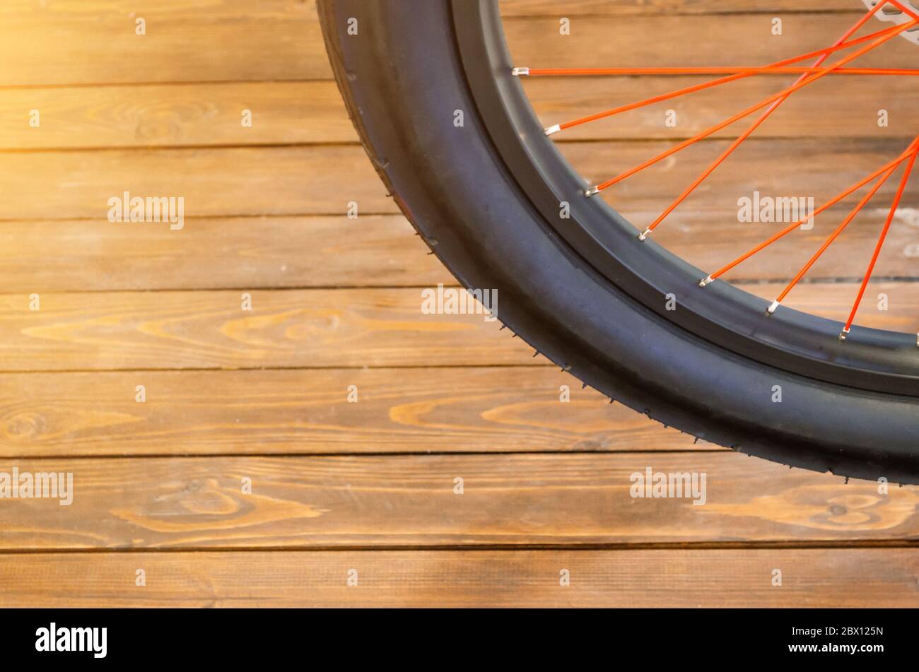 The wheel of a stylish bicycle with a black rim and a black rubber tire ...