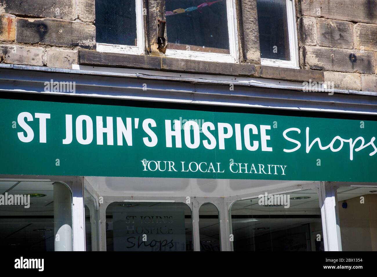 Exterior shot of St John's Hospice Charity shop Stock Photo - Alamy