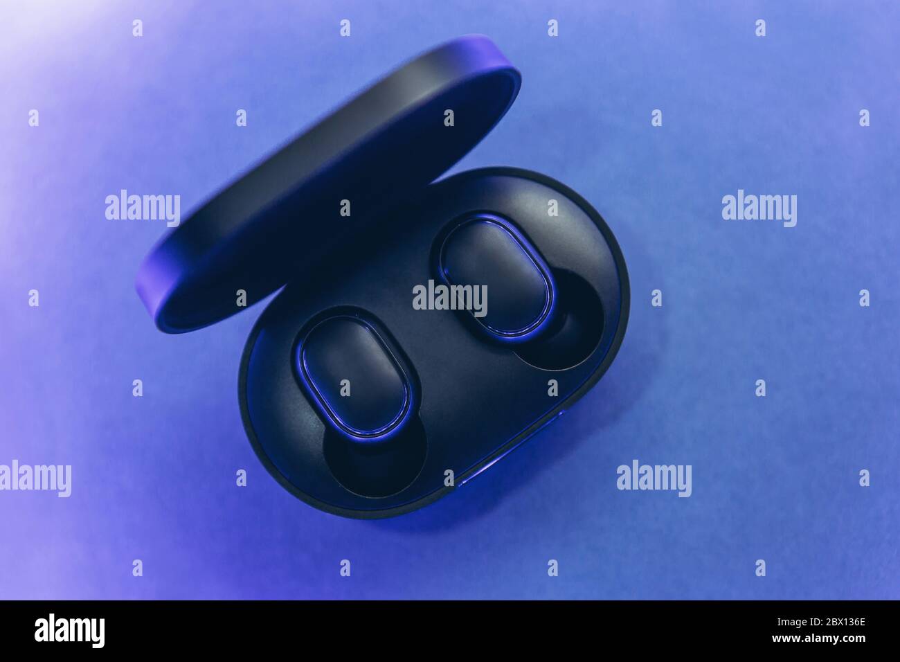 Wireless headphones on a trendy neon color gradient background Stock ...