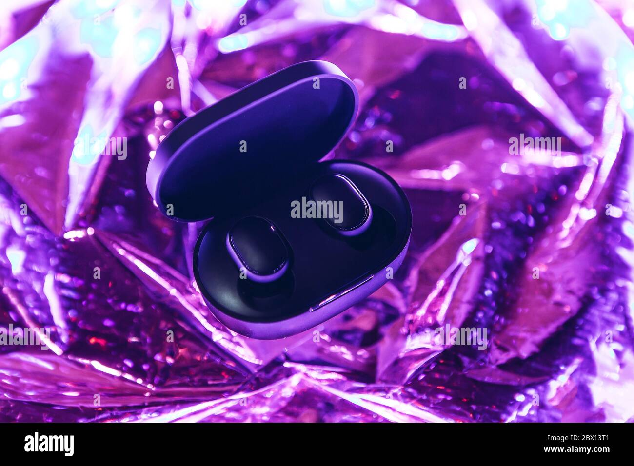 Wireless headphones on a trendy neon color gradient background Stock ...