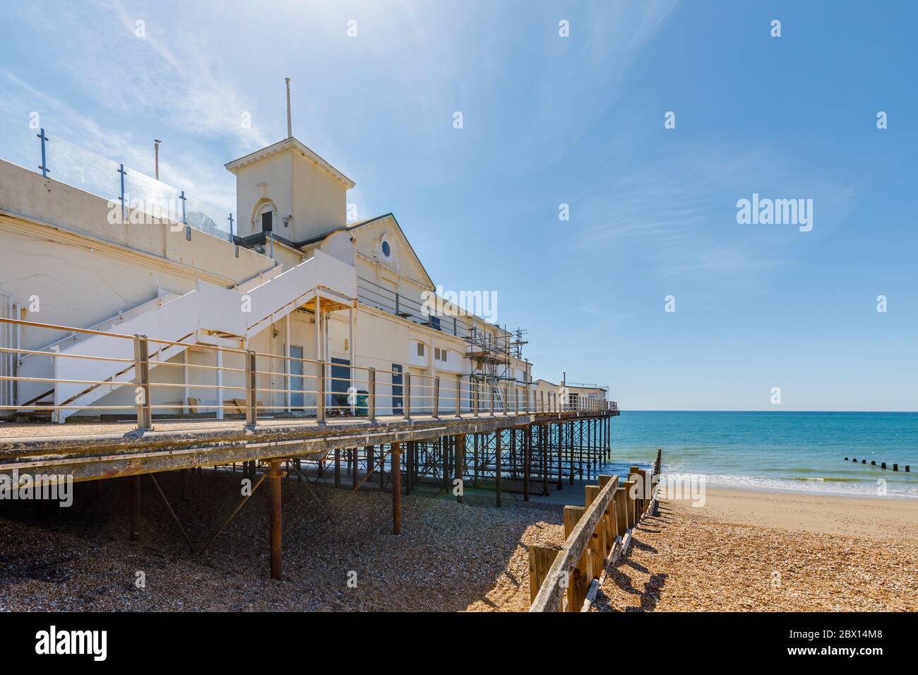 The pier and stony shingle beach on the seafront at Bognor Regis, a ...