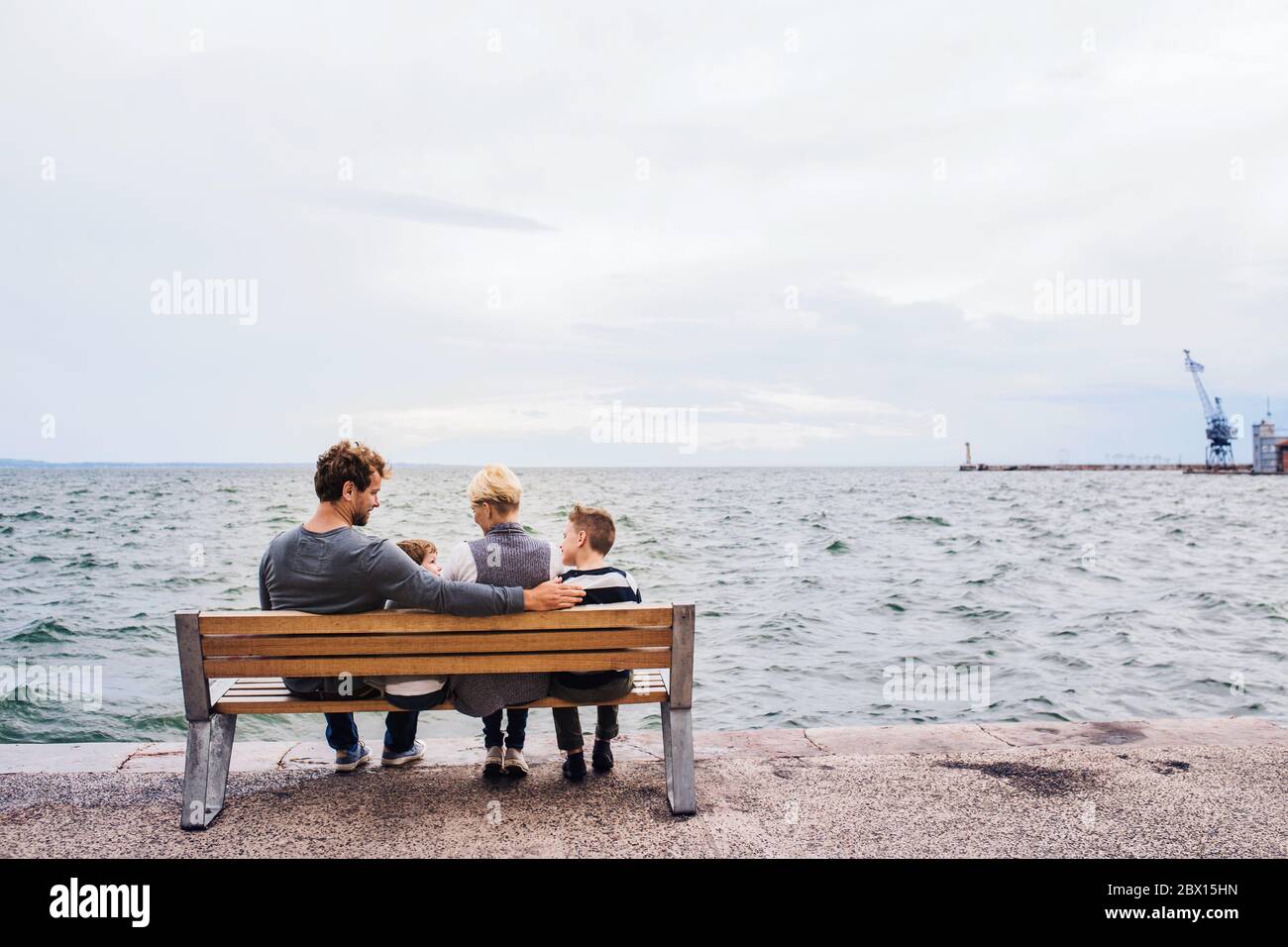 Boy sitting on bench rear view hi-res stock photography and images - Alamy Boy sitting on bench rear view hi-res stock photography and images - Alamy