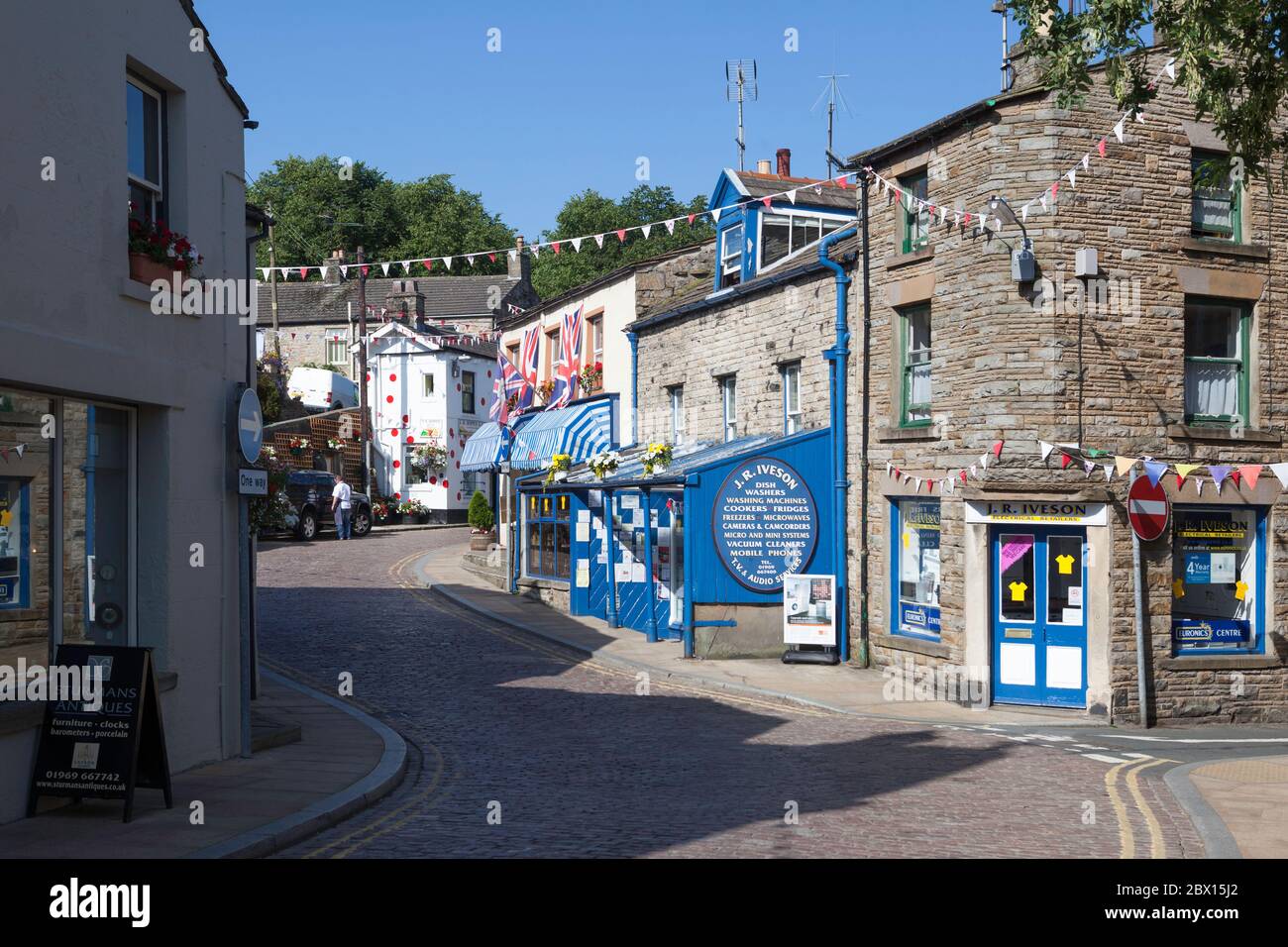Sunny Summer view of Main Street in the centre of the small Yorkshire ...