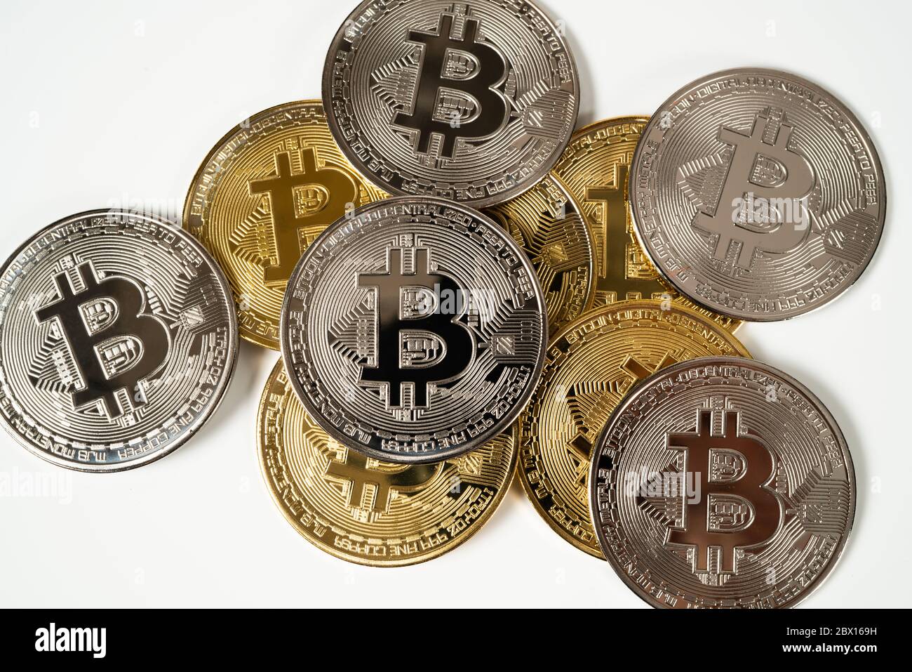 Golden and silver bitcoins on top of each other, visualising the crypto ...
