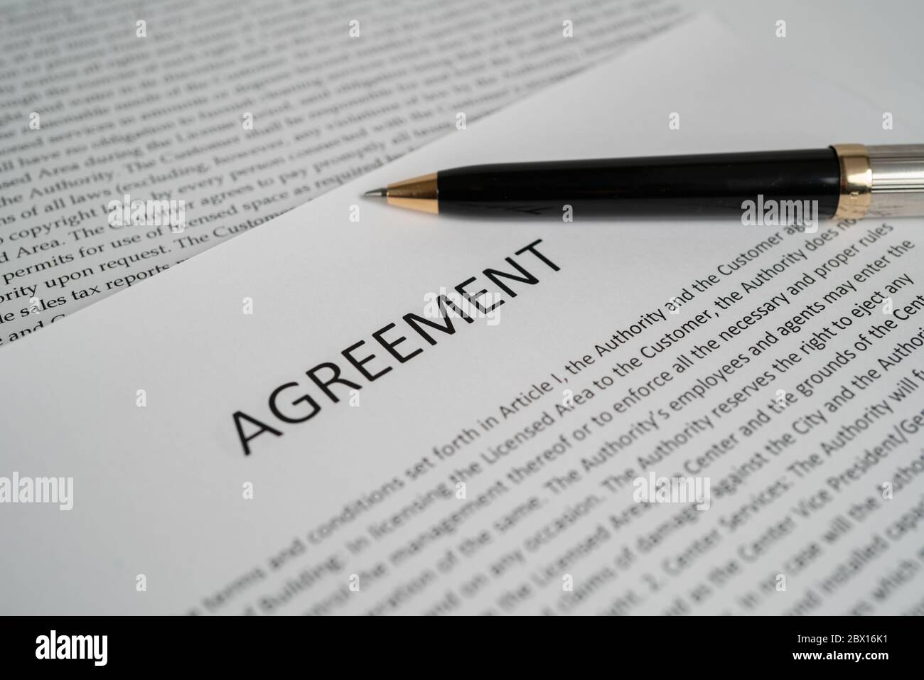 Close up of agreement with a pen ready to be signed Stock Photo - Alamy