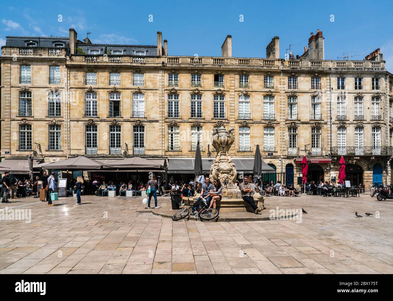 Bordeaux, France, 8 may 2018 - Tourist and locals sitting on the ...