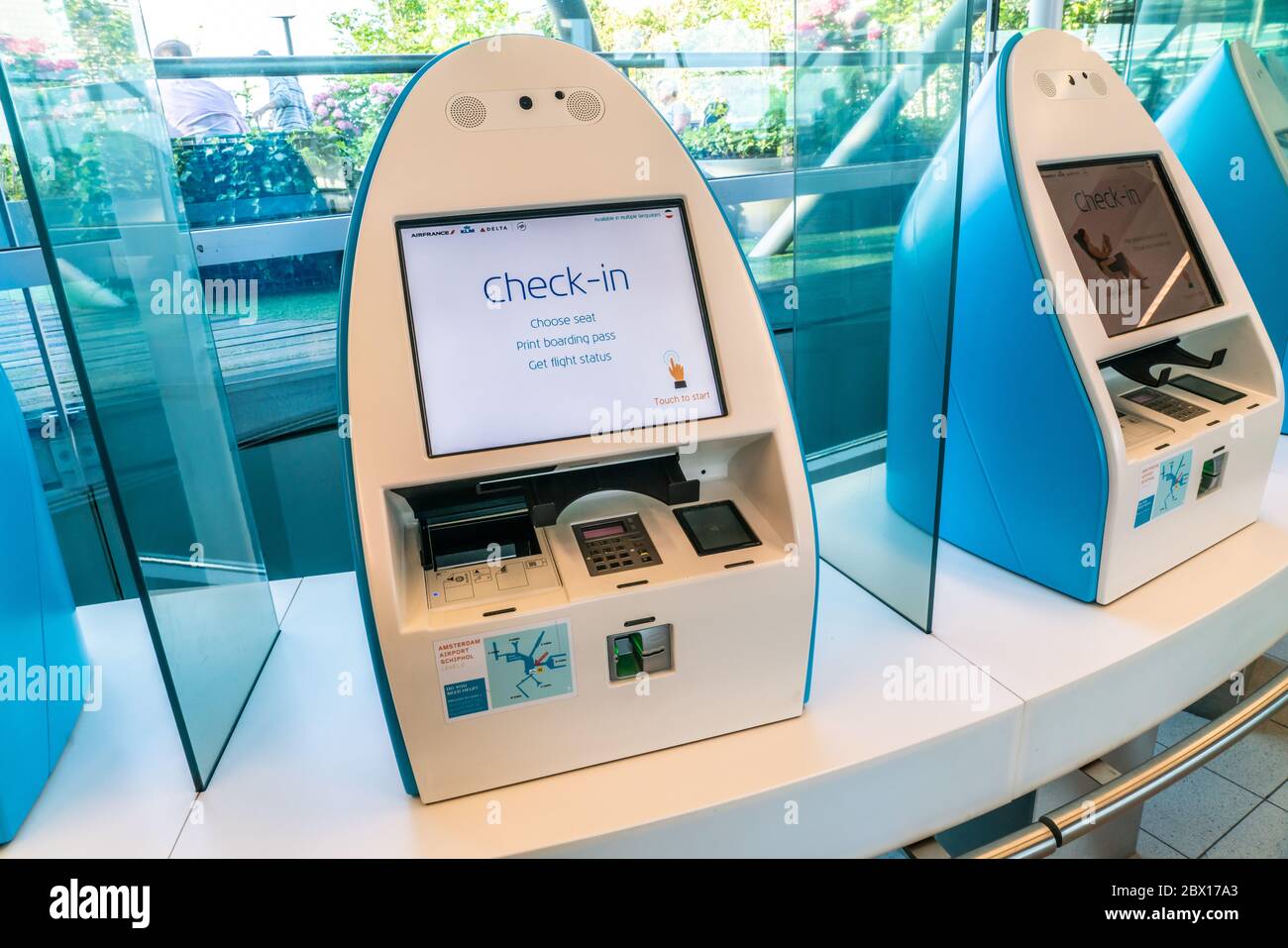 Digital Check in transfer counter at Schiphol airport Stock Photo - Alamy