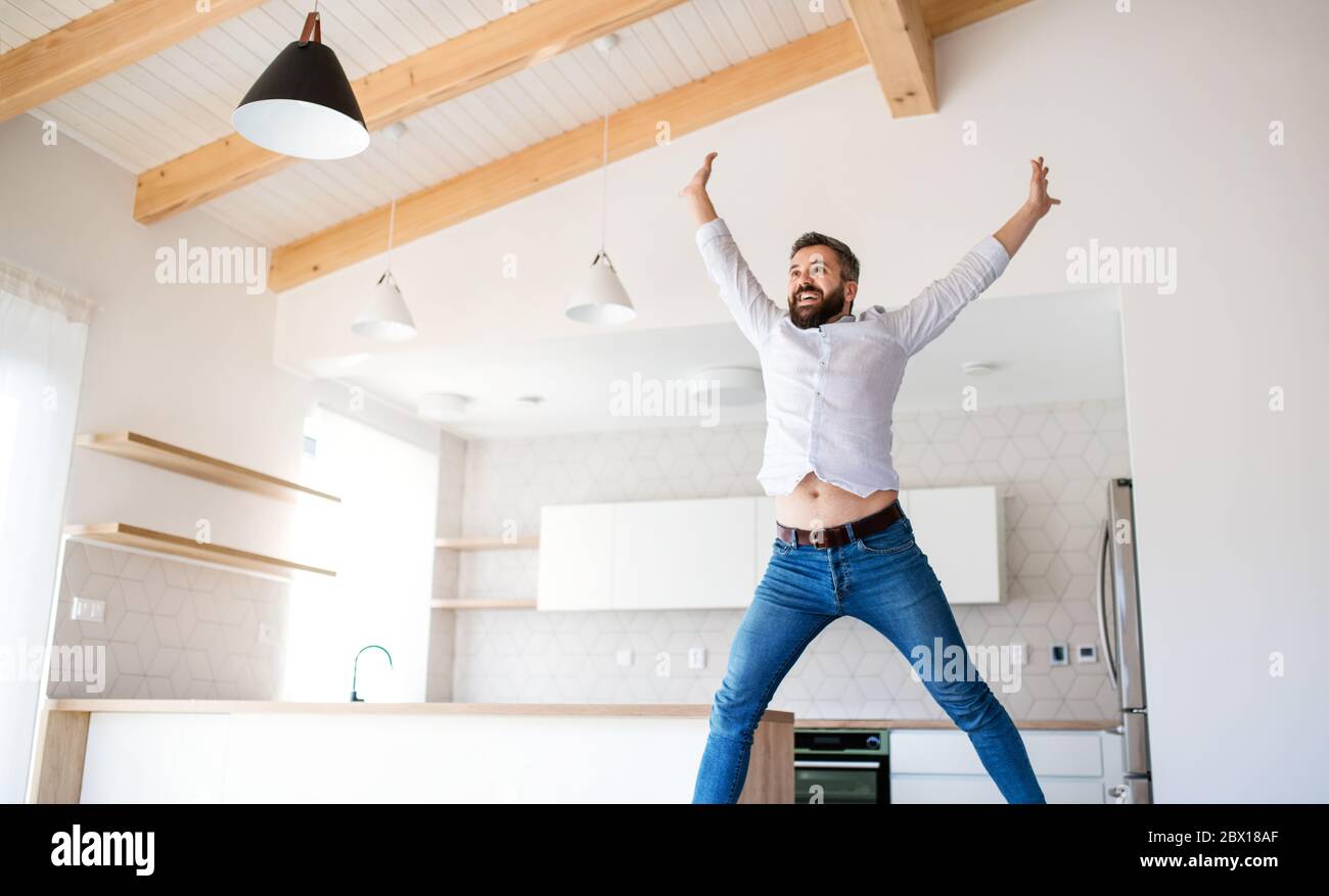 Man jumping house hi-res stock photography and images - Alamy
