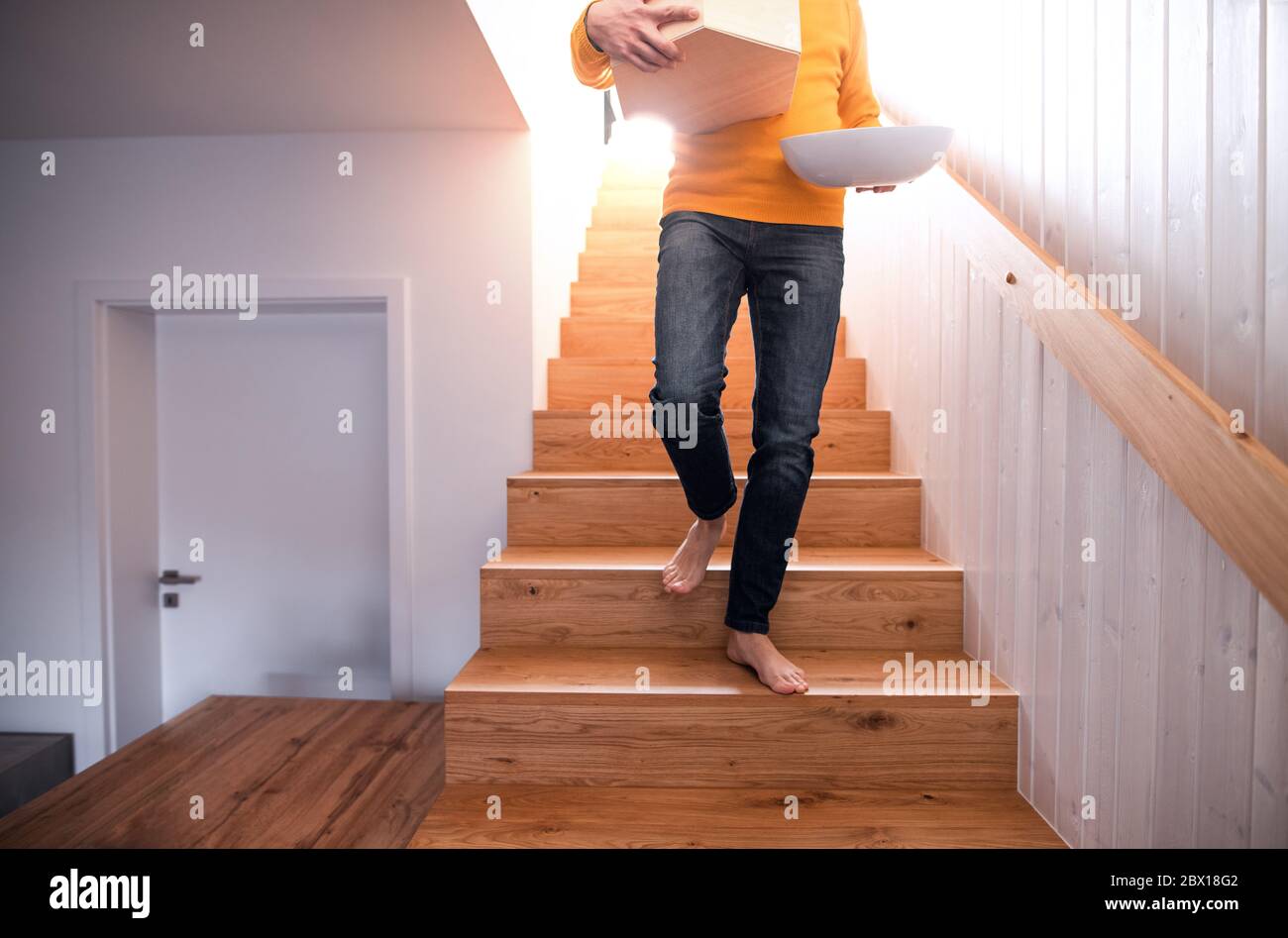 Man carrying boxes stairs hi-res stock photography and images - Alamy