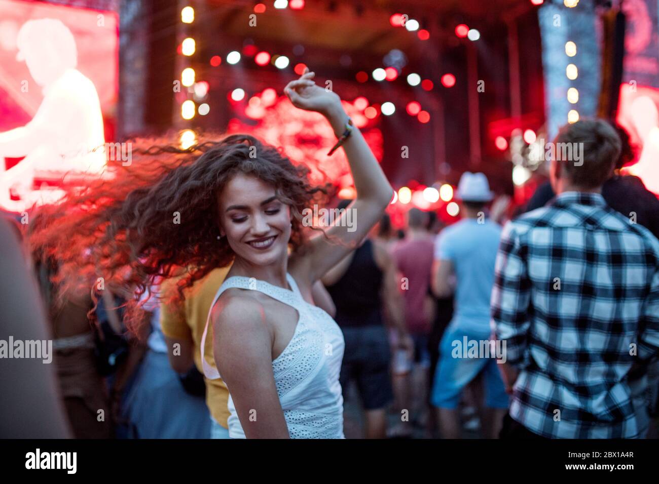 Beautiful young woman dancing at summer festival Stock Photo - Alamy
